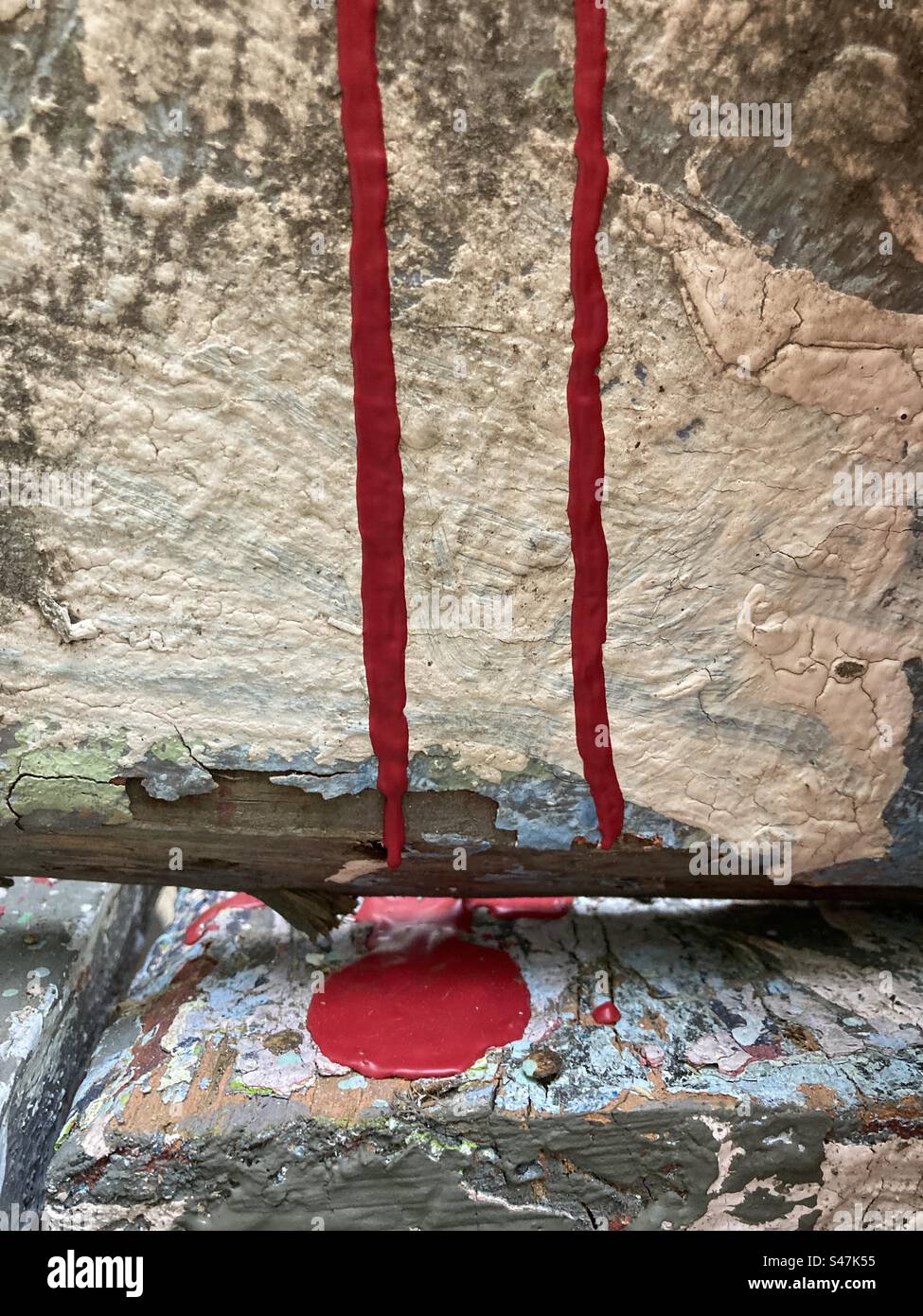 Red dried paint against grungy background Stock Photo - Alamy