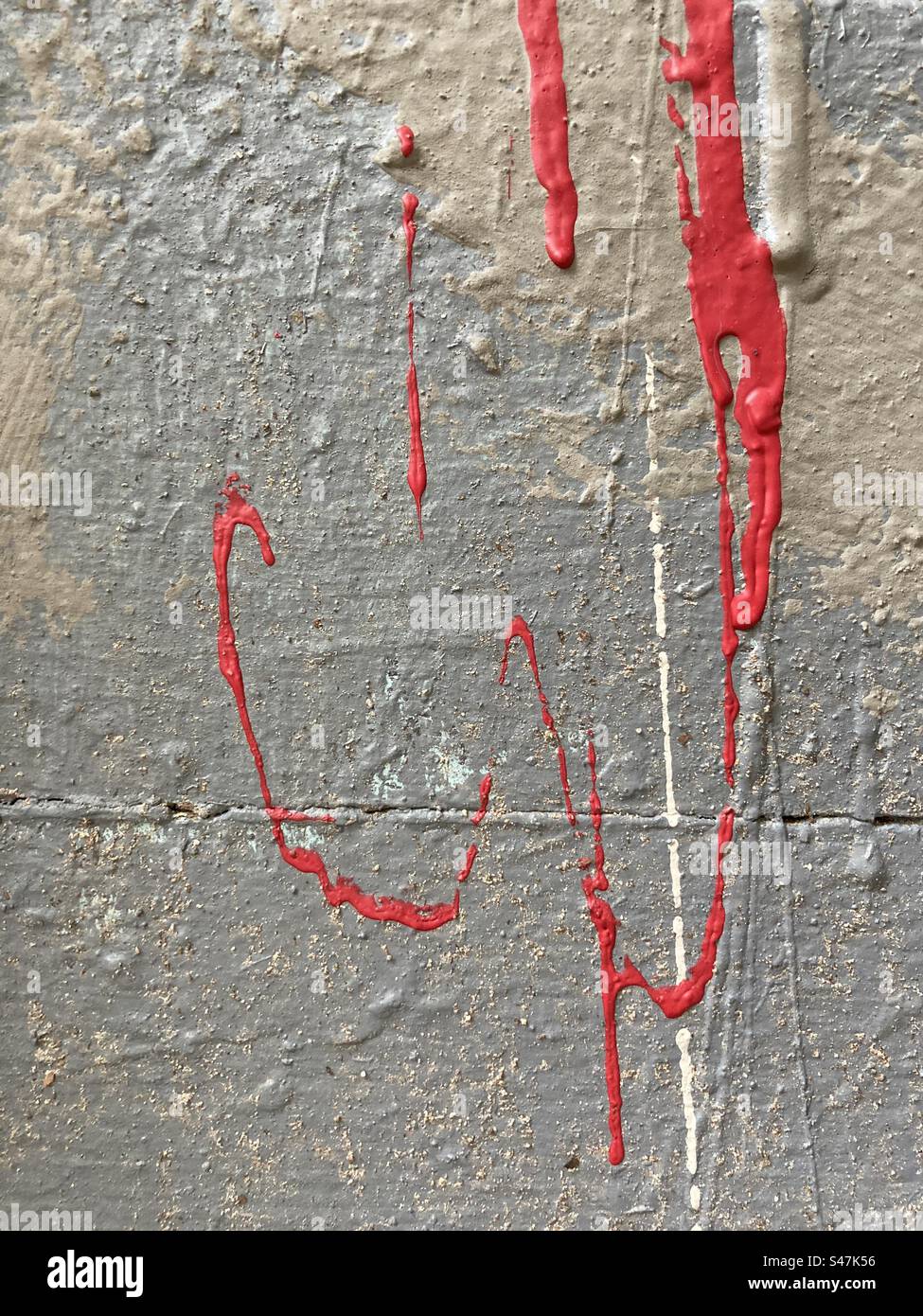 Red dried paint against grungy background Stock Photo - Alamy