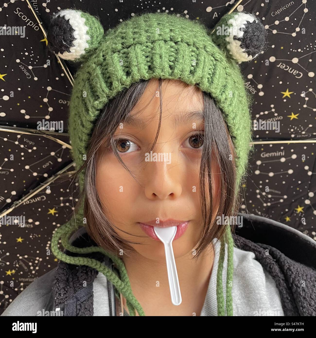 Girl in frog beanie Stock Photo - Alamy