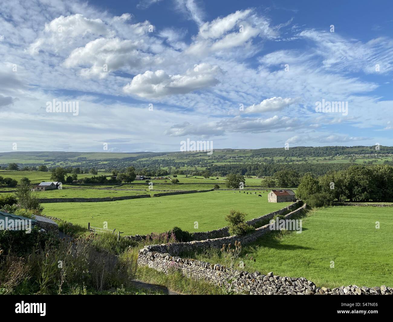 Landscape view, over fields, dry stone walls, meadows and hills in ...