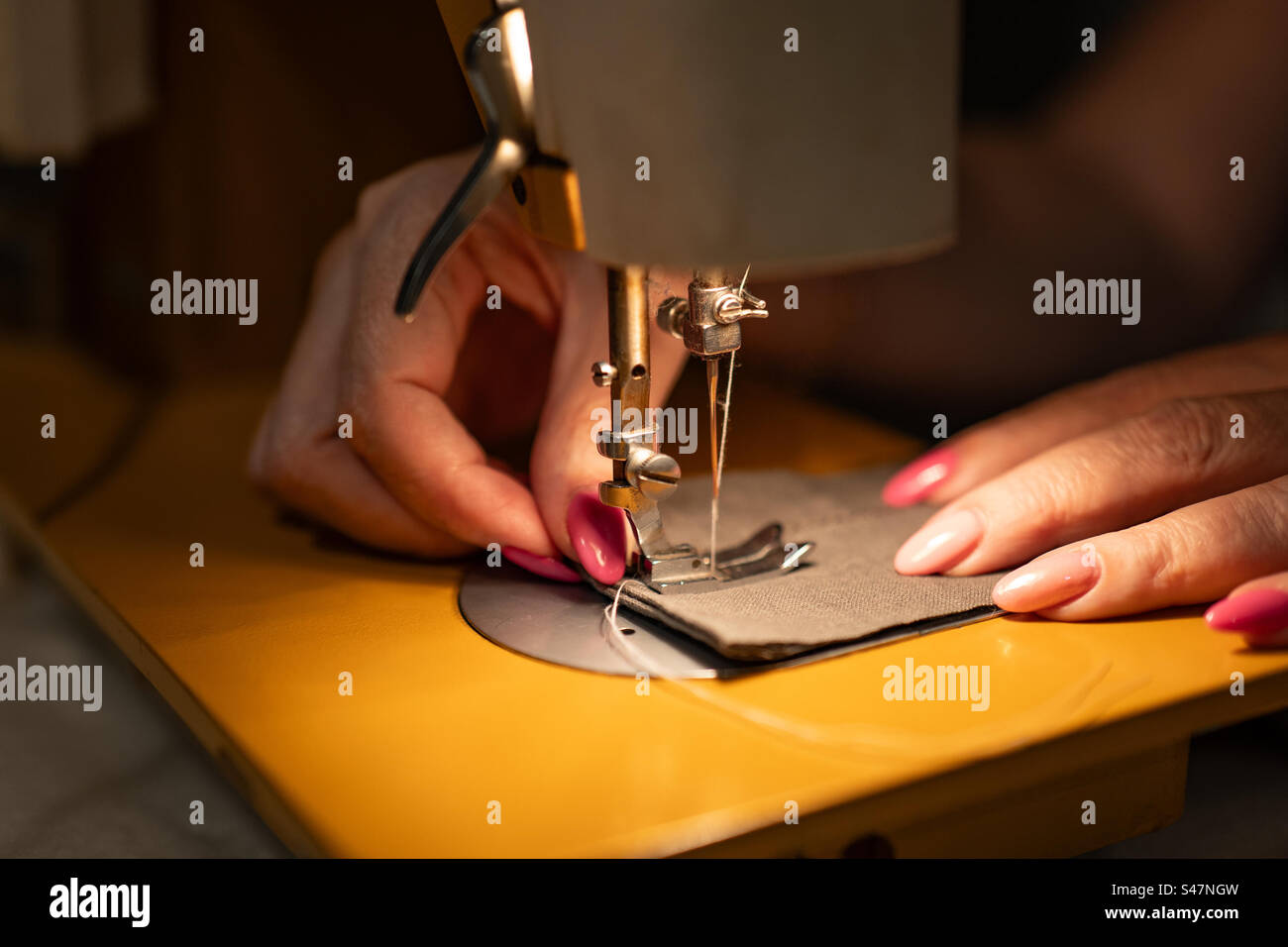 sewing on a sewing machine Stock Photo - Alamy
