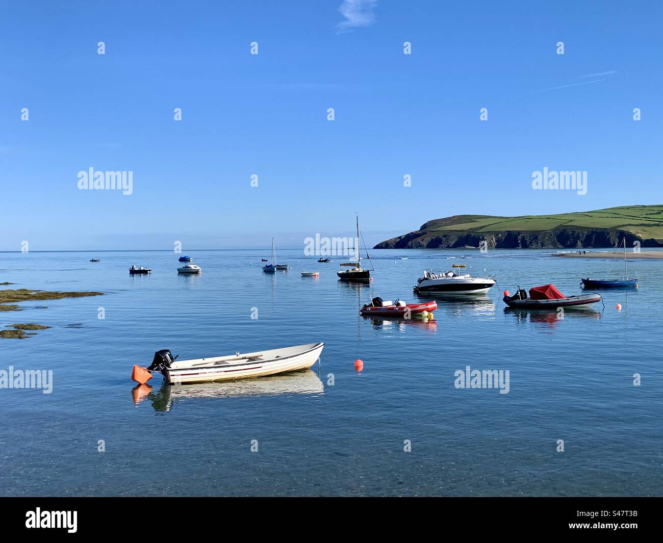 Boats on still sea water in Newport, Pembrokeshire, west Wales Stock ...