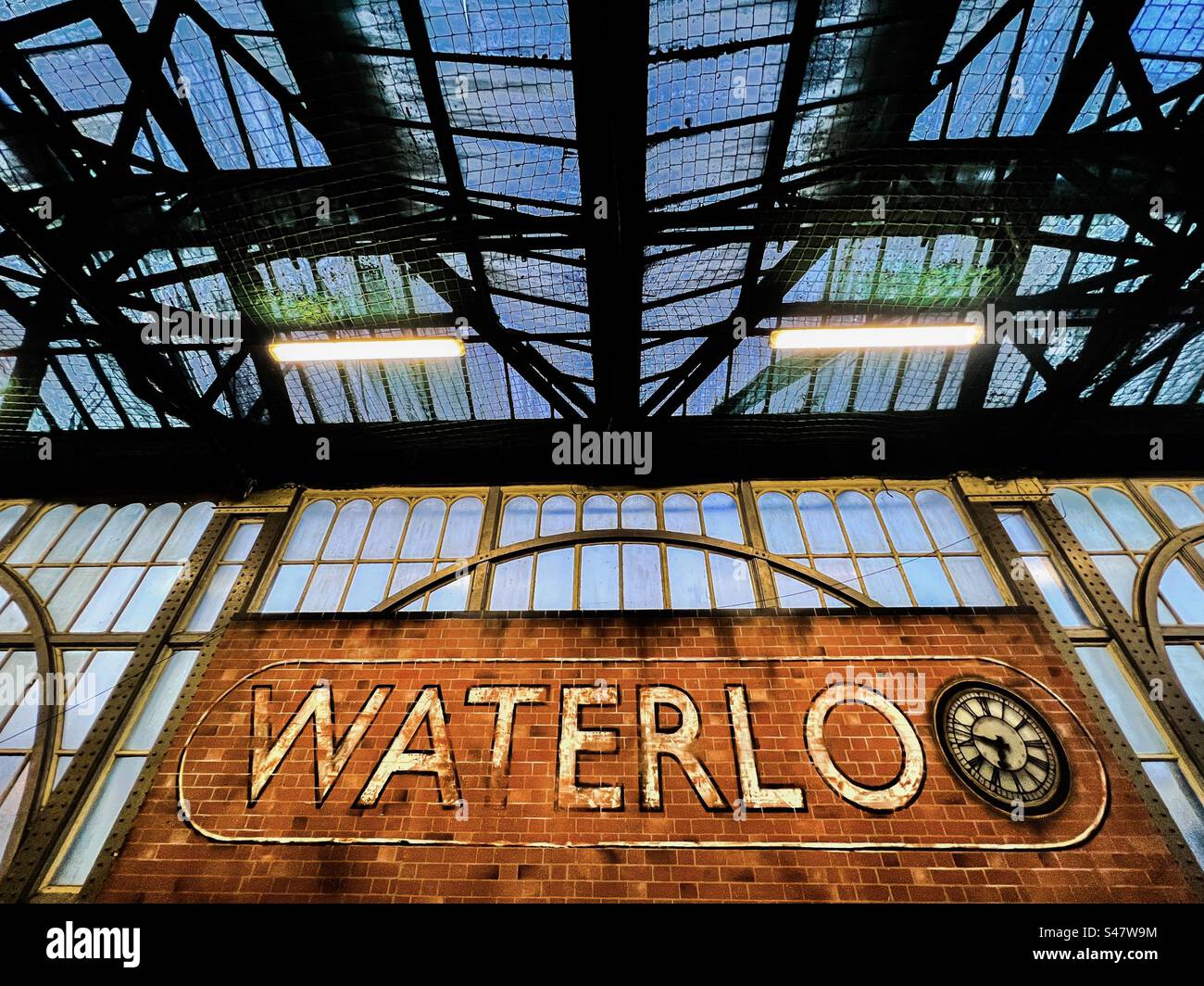 Waterloo Station Sign and Clock Stock Photo - Alamy