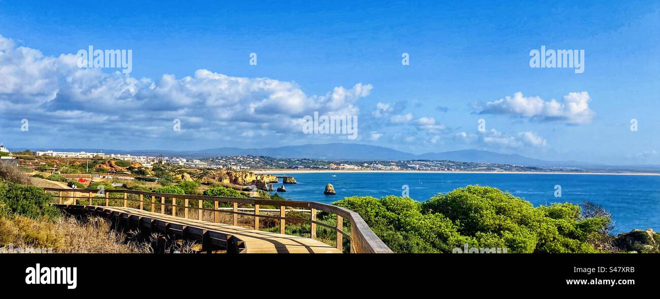 Wooden cliff top boardwalk panoramic of the Lagos coast line in ...