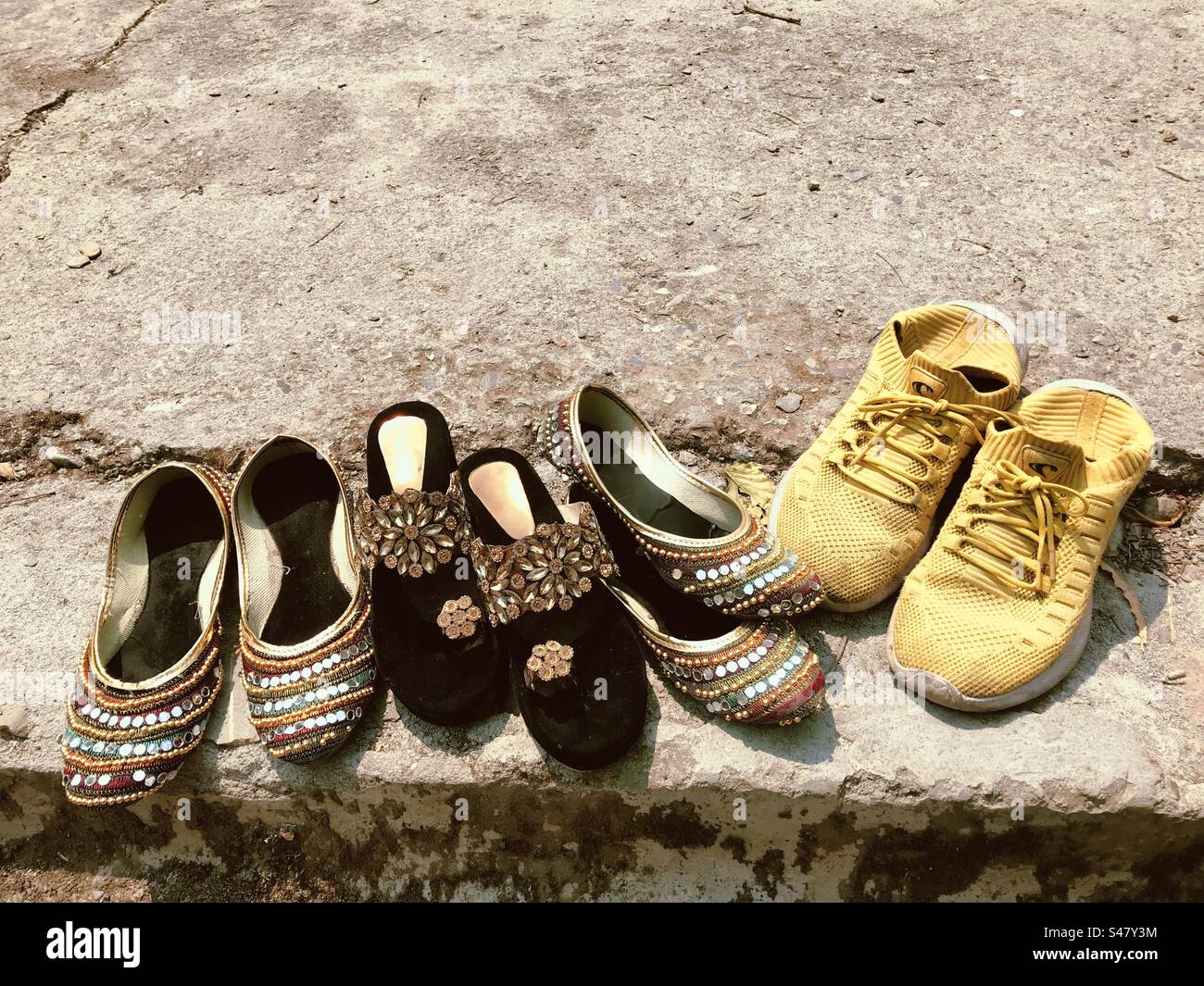 Footwear kept outside a temple in India Stock Photo - Alamy