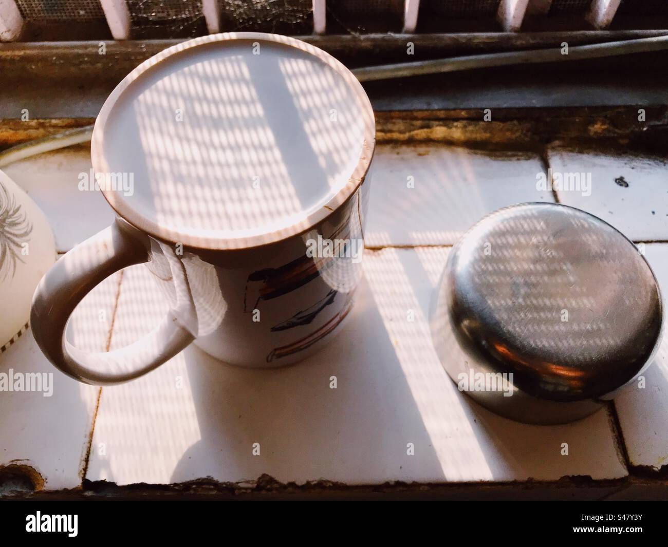 Coffee mug kept upside down Stock Photo - Alamy