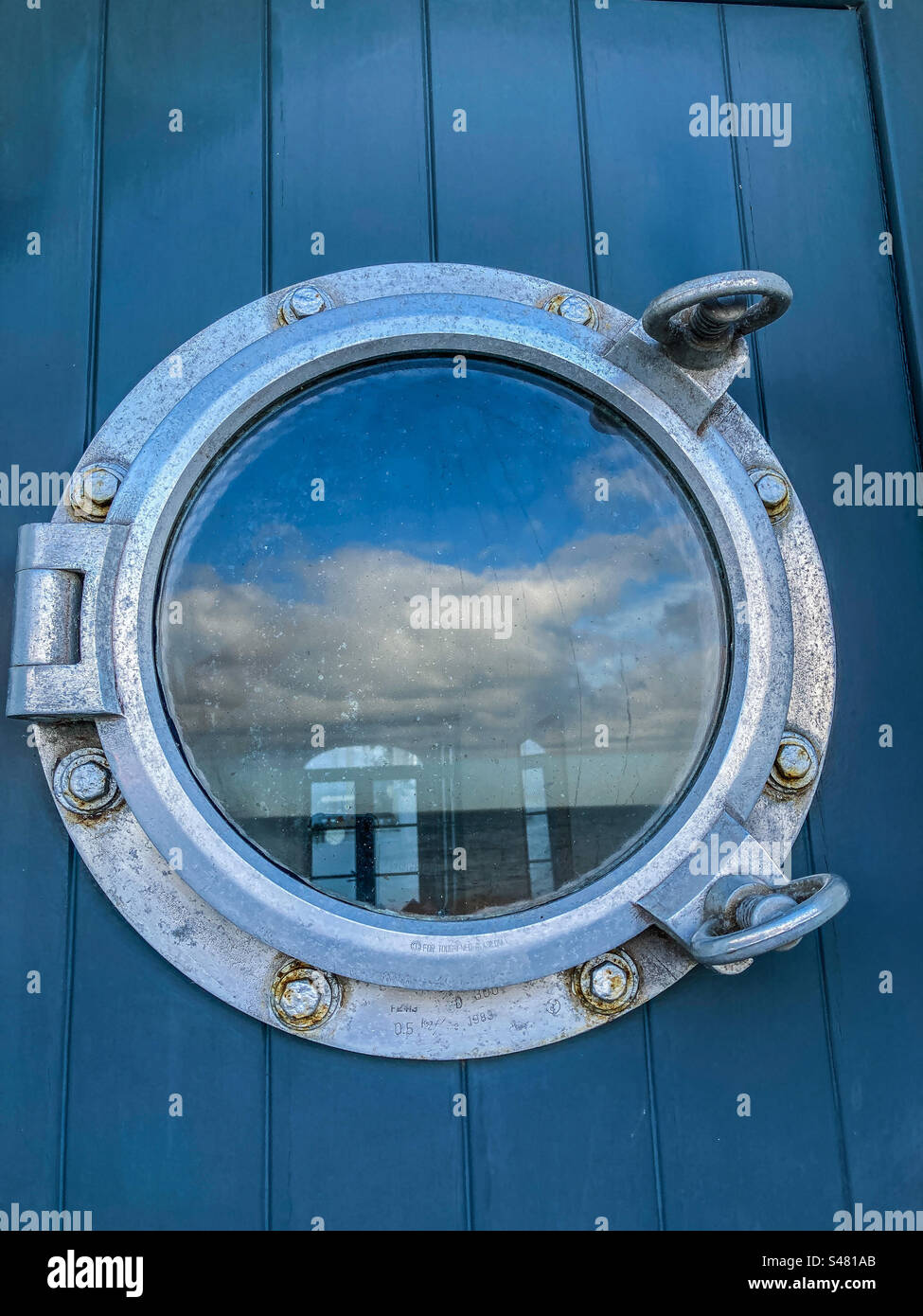 Porthole mounted on the front door of a seaside house in Deal, Kent ...