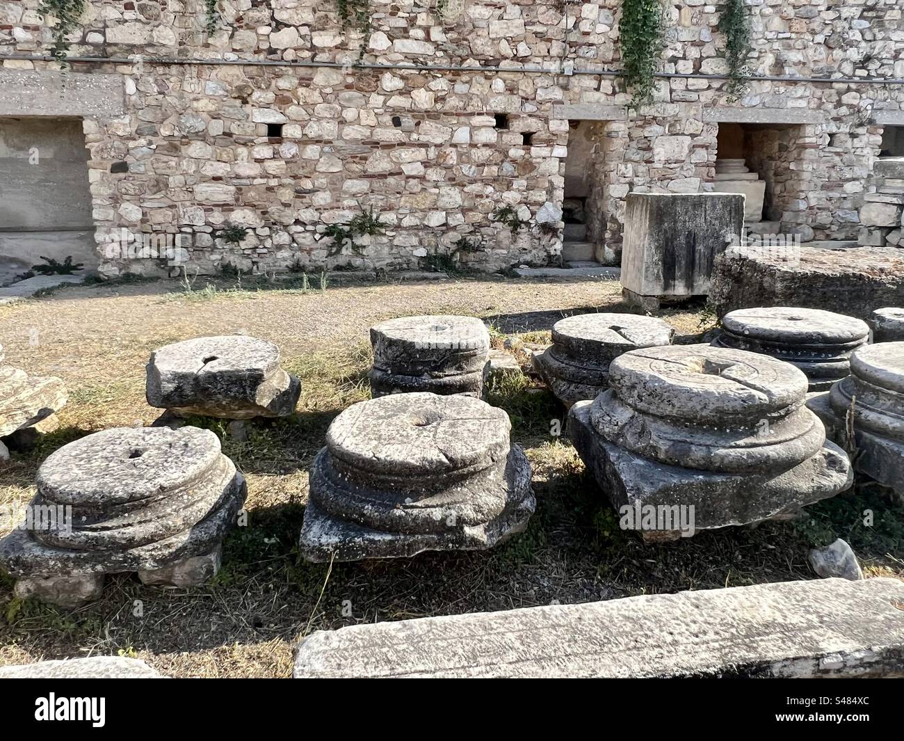Ruins of marble column bases in the Library of Hadrian archaeology site ...