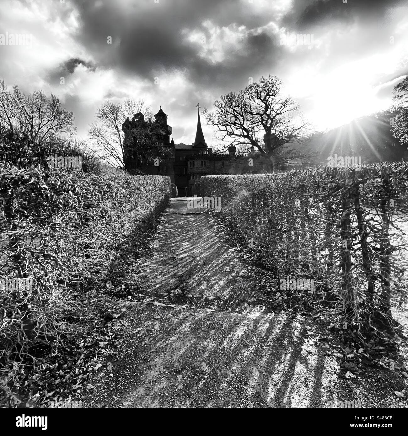 An old castle at sunset: Light and shadow on the way to the historical ...