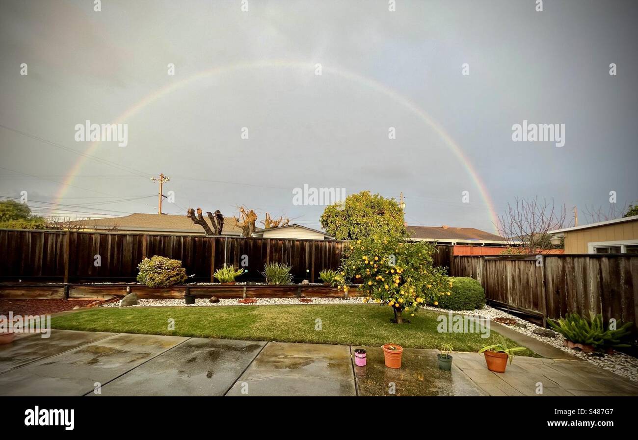 Rainbow in the backyard Stock Photo - Alamy