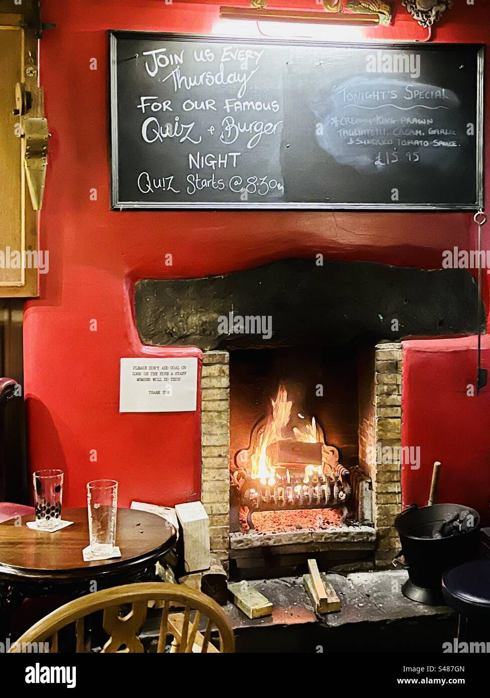 Log open fire in pub in England Stock Photo - Alamy