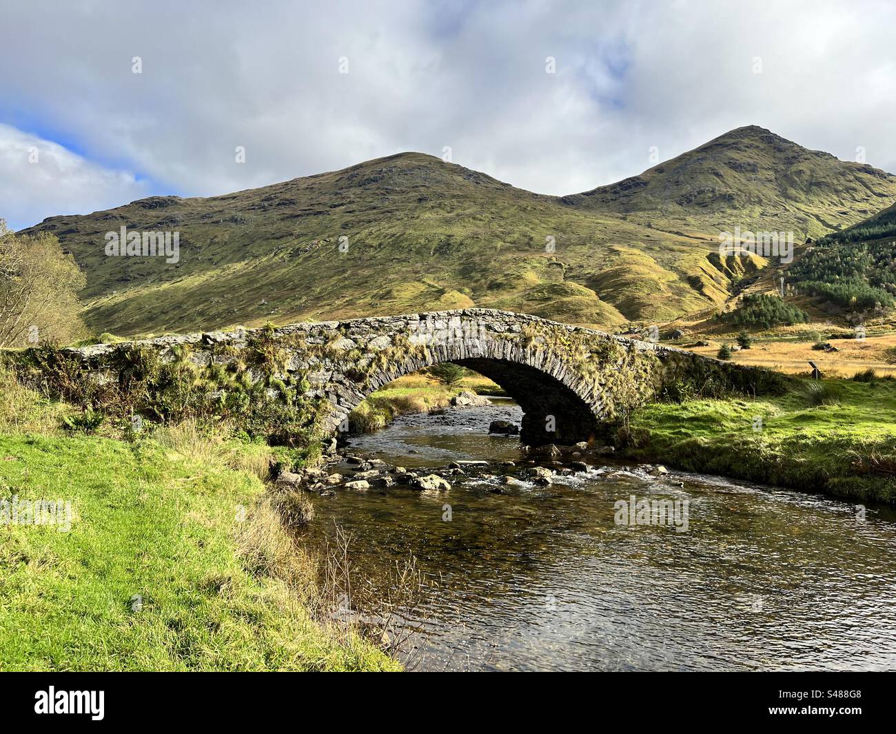 A traditional stone Butter Bridge over Kinglas Water in Scottish ...
