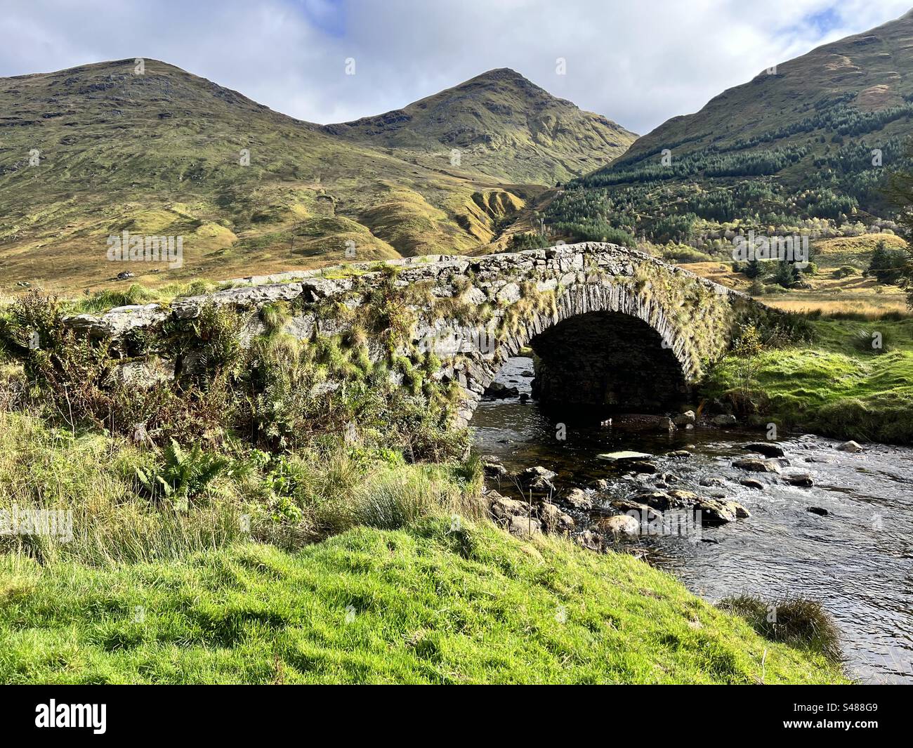 A traditional stone Butter Bridge over Kinglas Water in Scottish ...
