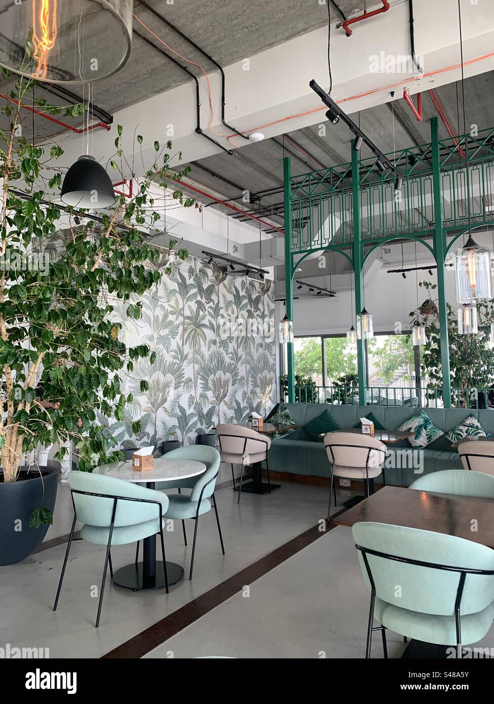 Modern cafe interior in Dubai, UAE Stock Photo - Alamy