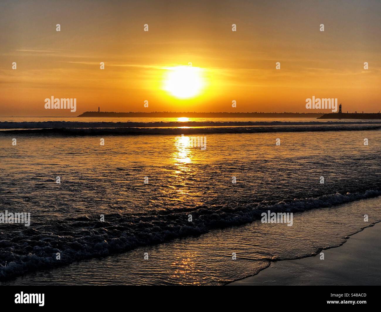 Two peers of Viana do Castelo port sticking out into Atlantic Ocean ...