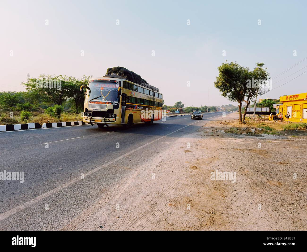 Passenger bus on an Indian highway Stock Photo - Alamy