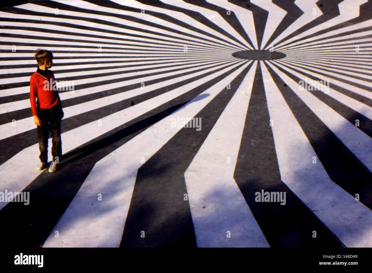 Red boy in a spiral hi-res stock photography and images - Alamy