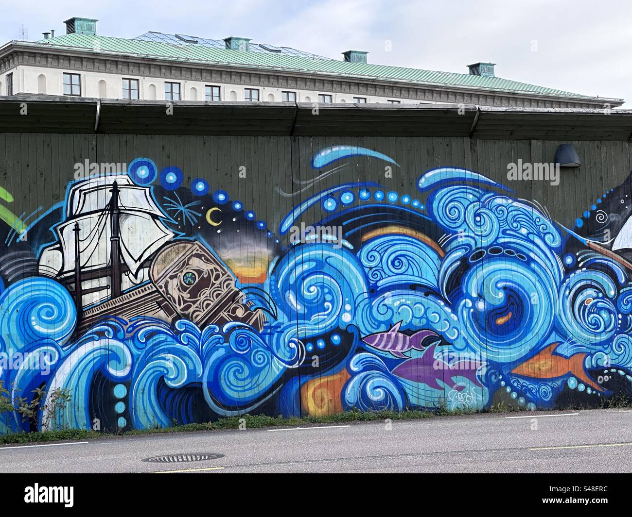 Part of a mural depicting a sailing ship on the sea, leading to the ...