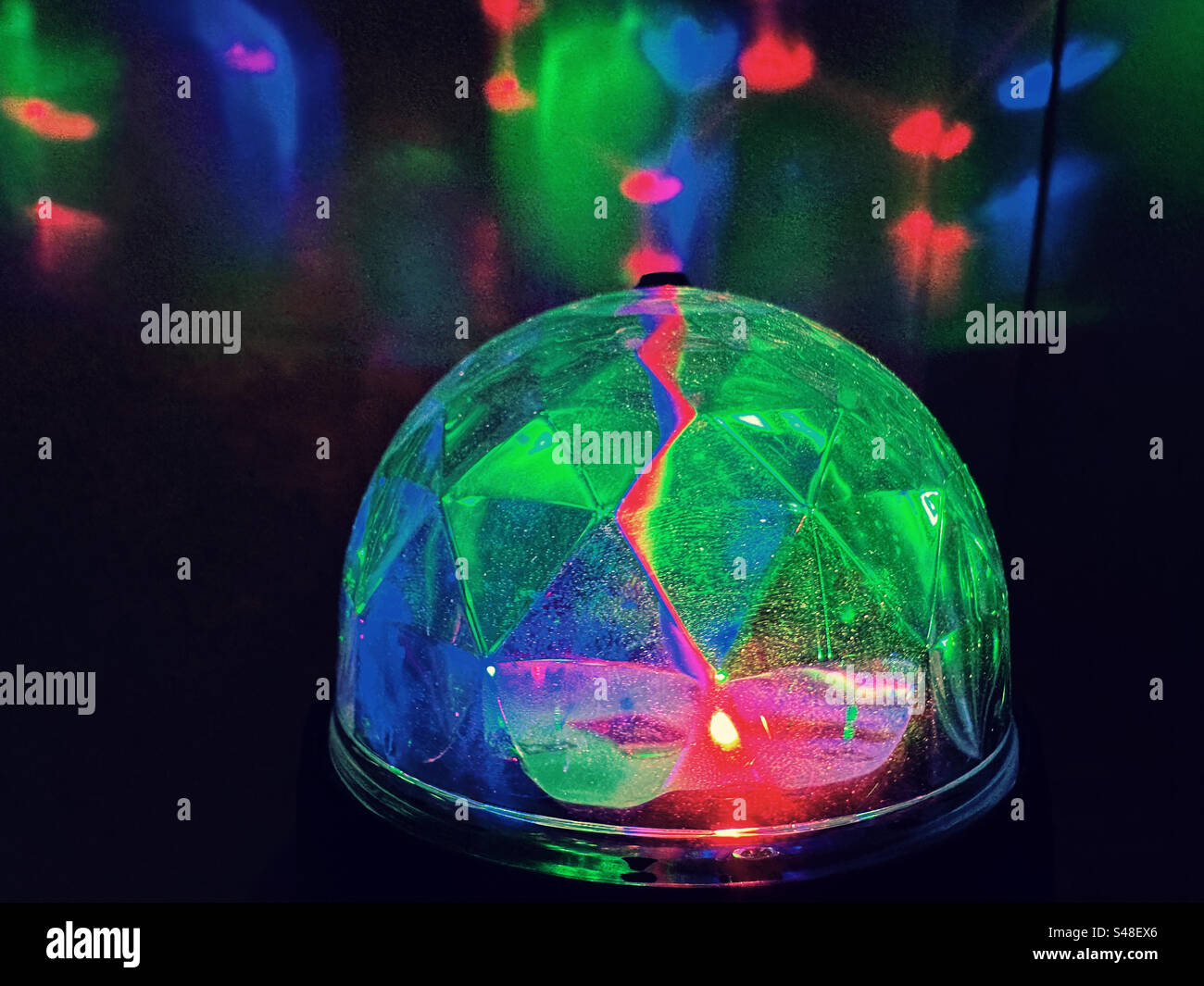 Colorful disco light at a party Stock Photo - Alamy