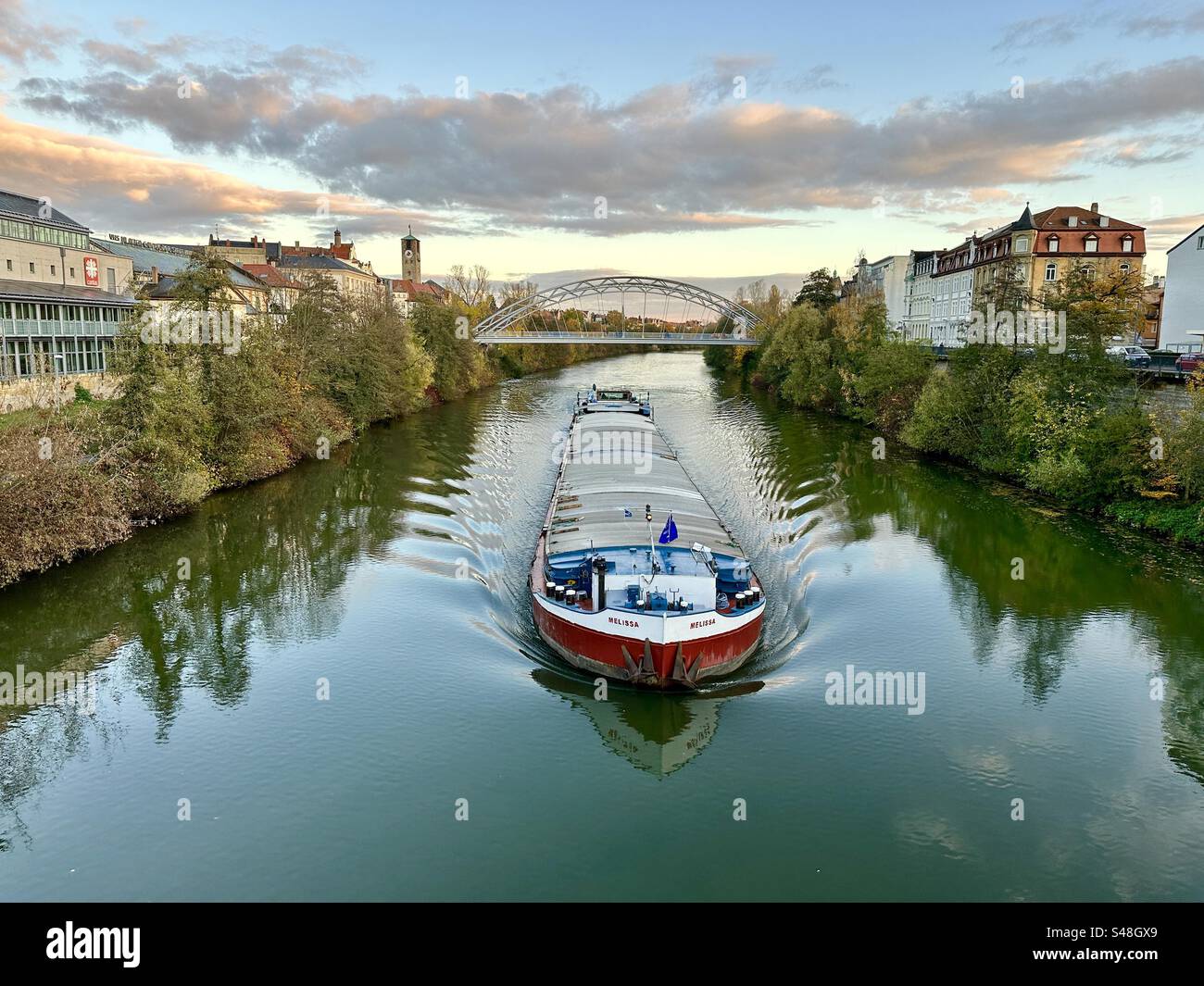 Cargo barge swimming by river Regnitz in Bamberg, Germany Stock Photo ...