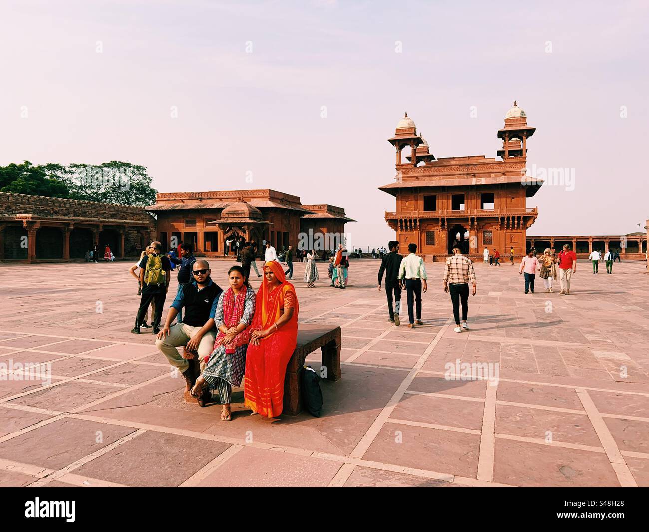 Indian tourists dressed in bright traditional clothes posing for ...