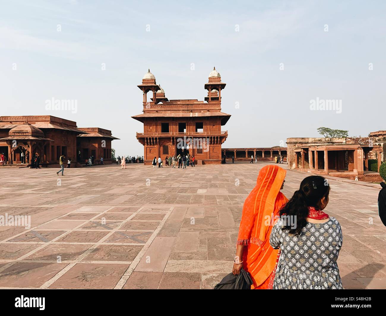 Indian tourists dressed in bright traditional clothes exploring Akbar ...