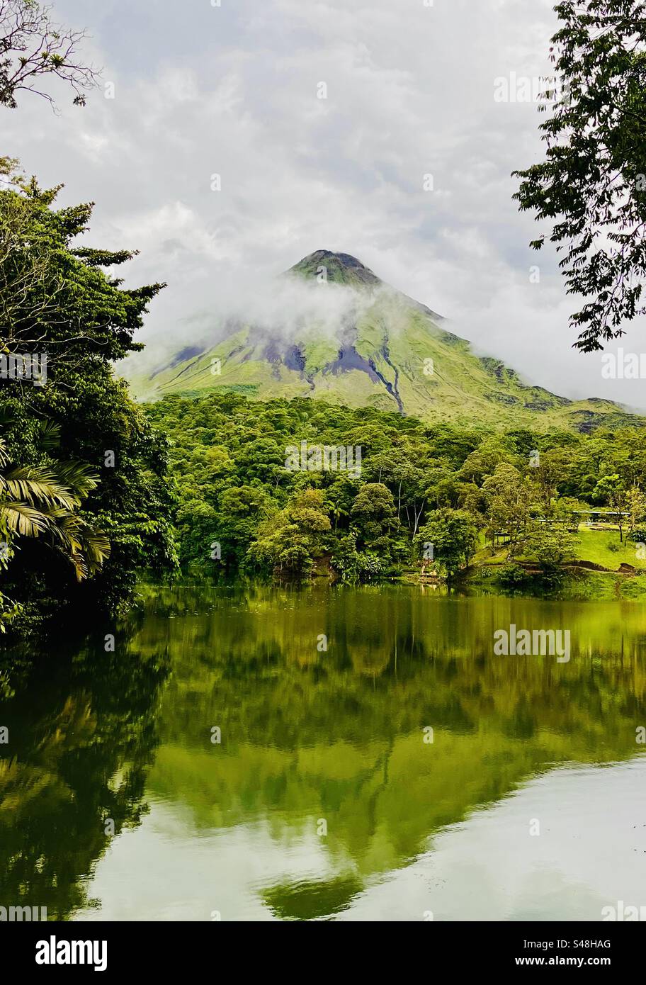 Volcano arenal in clouds hi-res stock photography and images - Alamy