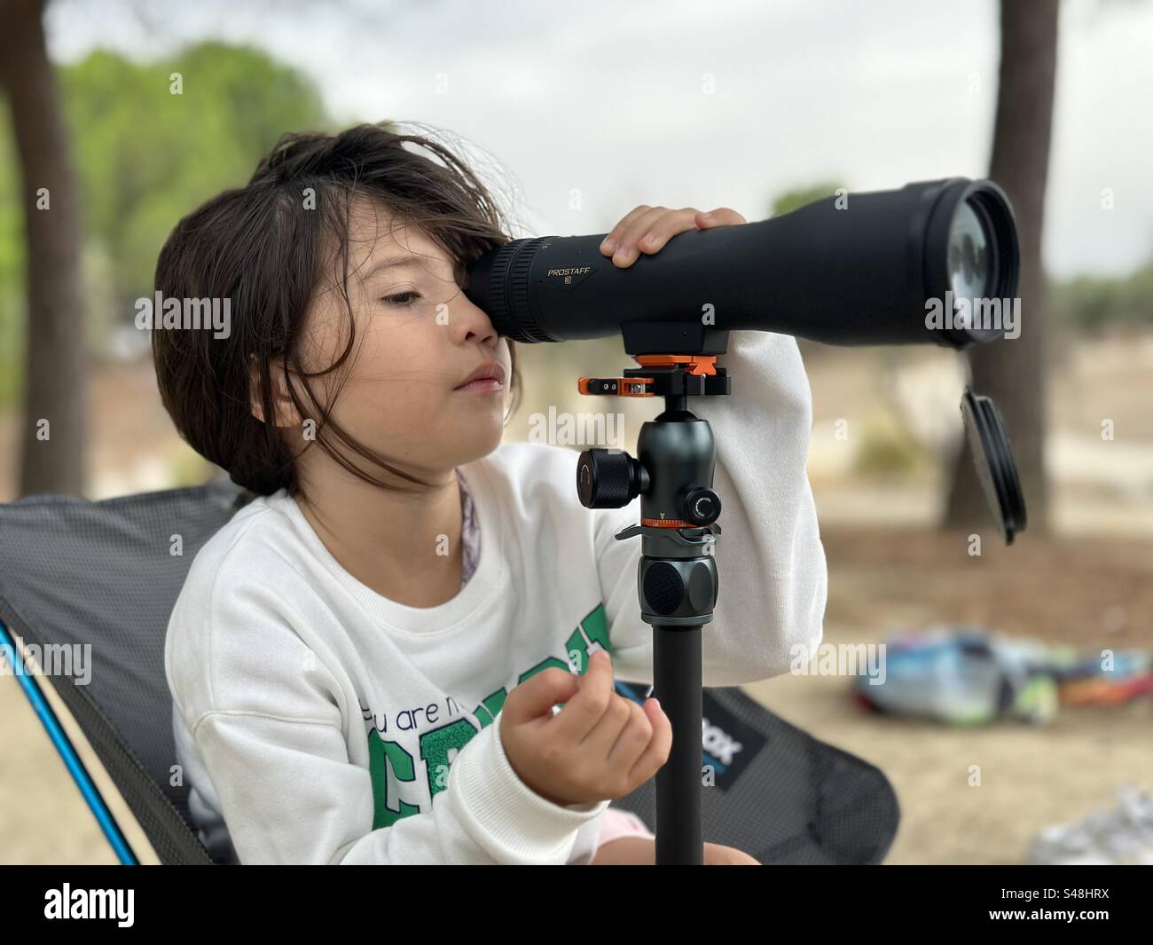 Peaking through telescope hi-res stock photography and images - Alamy