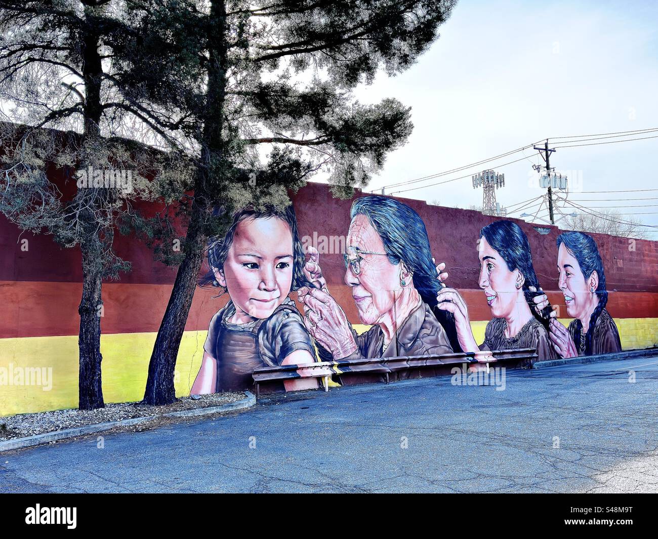 Wall mural of 4 women braiding each other’s hair in Longmont, Colorado ...