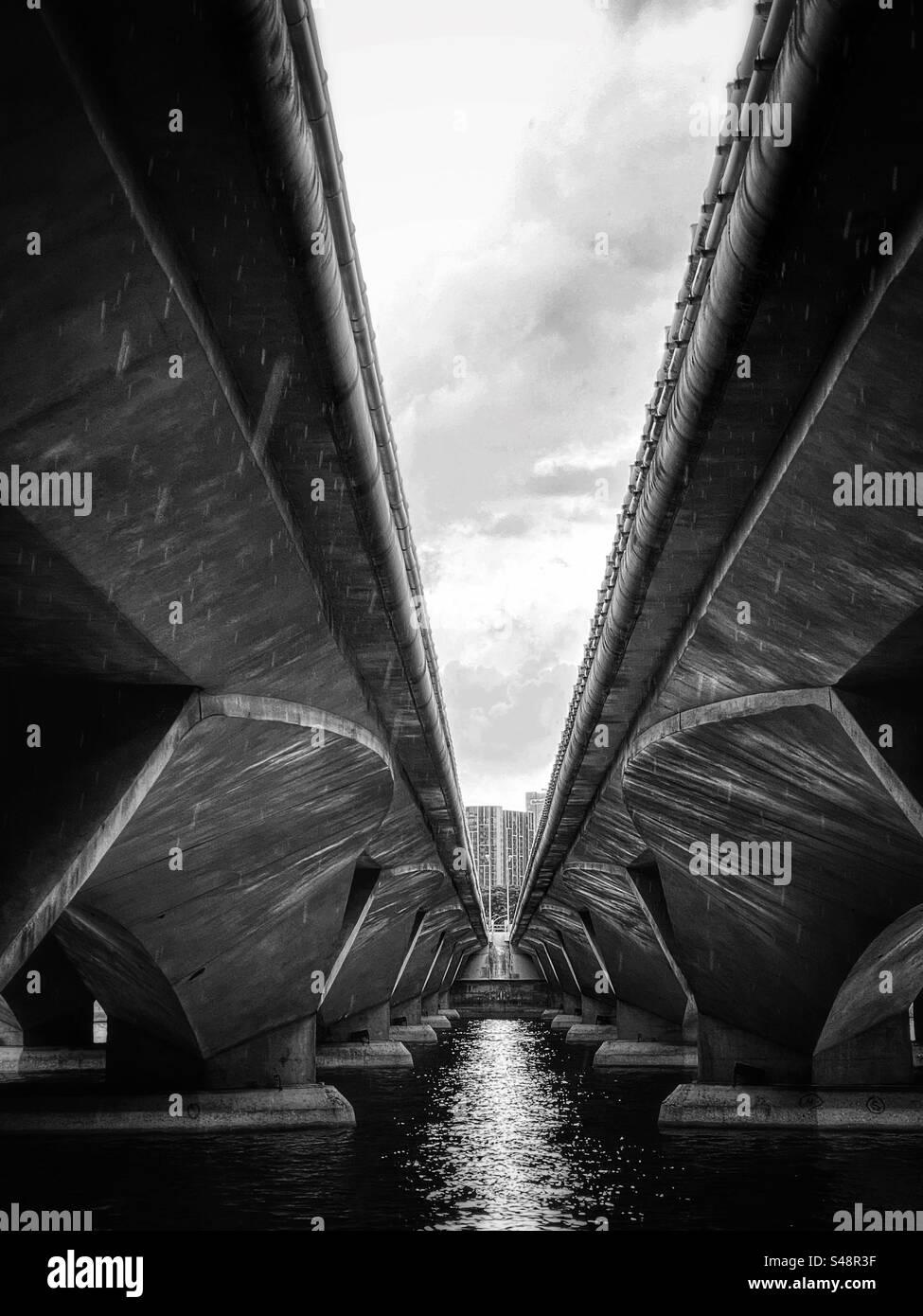 Under the bridge in the rain Stock Photo - Alamy