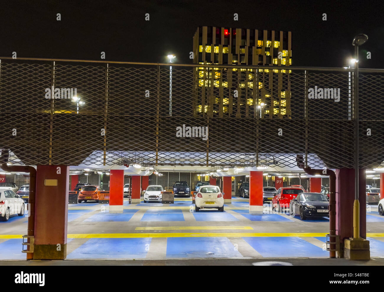 Parking and high rise Stock Photo - Alamy