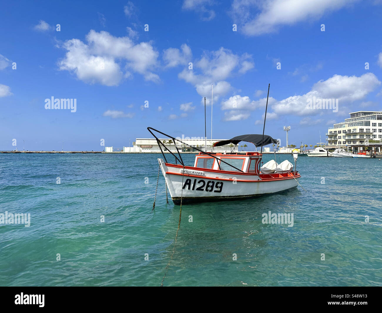Small boat moored in Oranjestad harbour, Aruba, Dutch Antilles ...