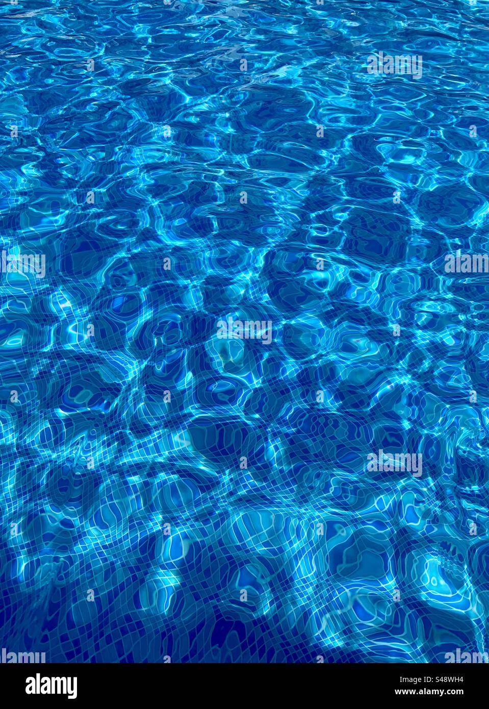 Blue Swimming pool water patterns and shapes Stock Photo - Alamy