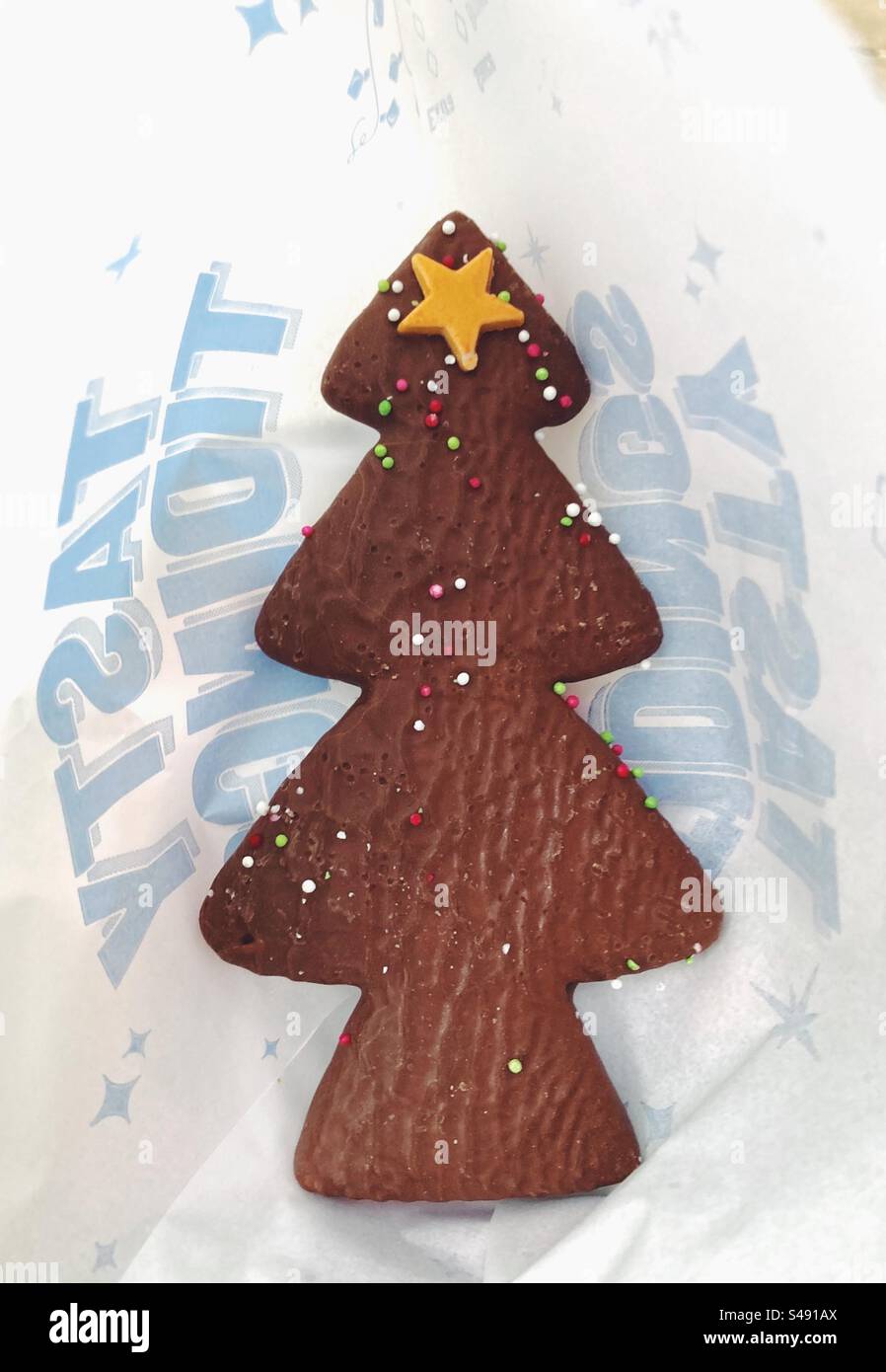 Christmas tree shaped biscuit-gingerbread covered in milk chocolate and ...