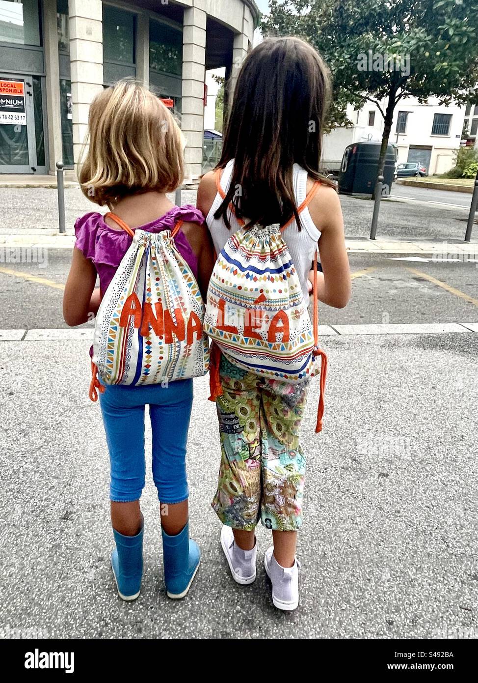 Girls with backpacks Stock Photo - Alamy