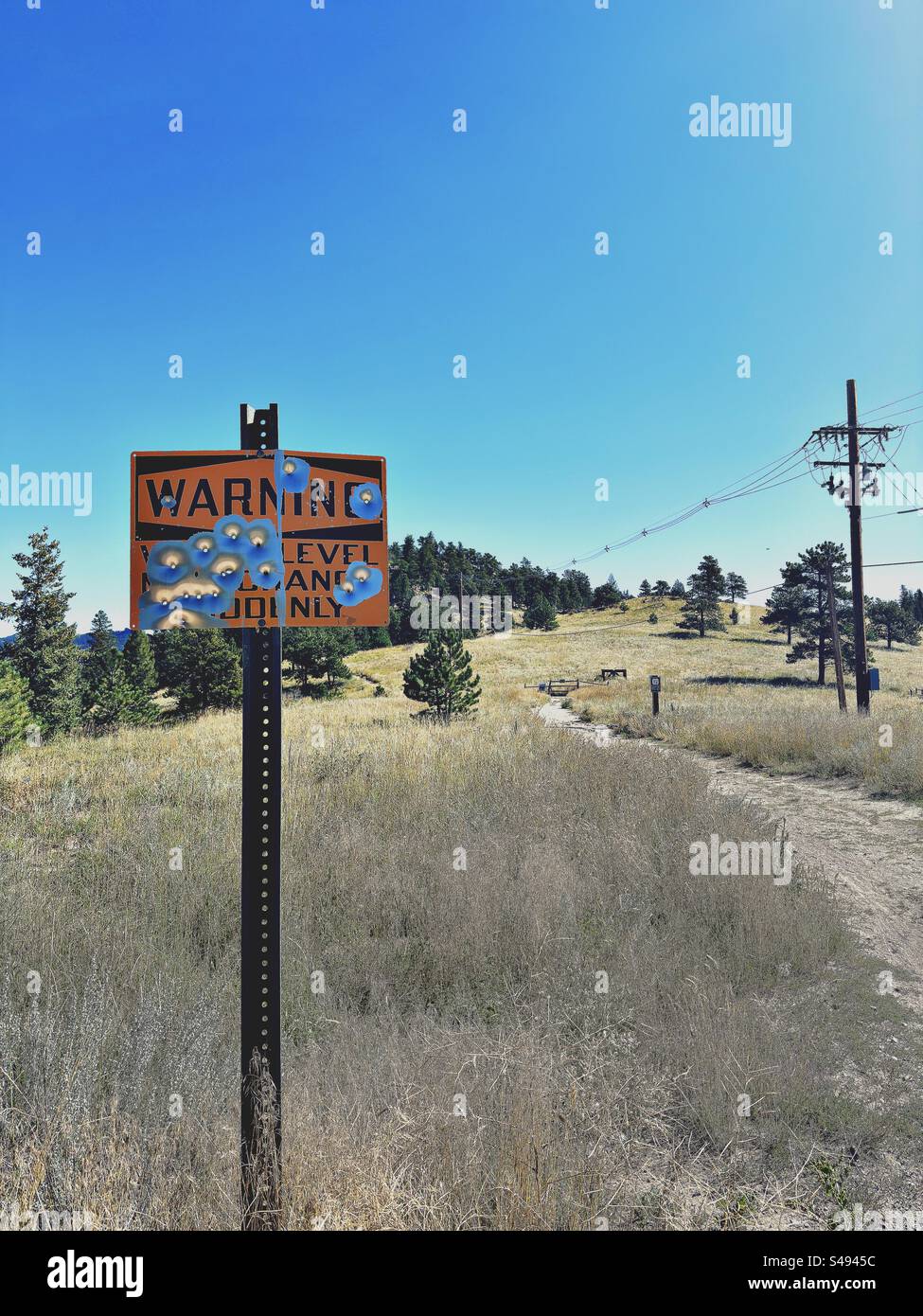 Warning sign in Eldorado Canyon State Park with bullet holes in it ...