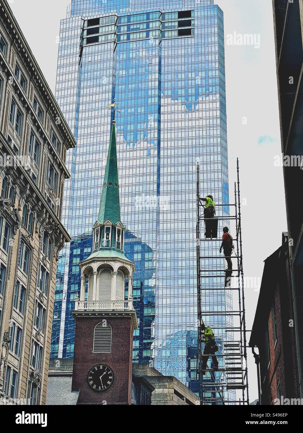 Construction workers on scaffolding in Boston, Massachusetts, USA ...