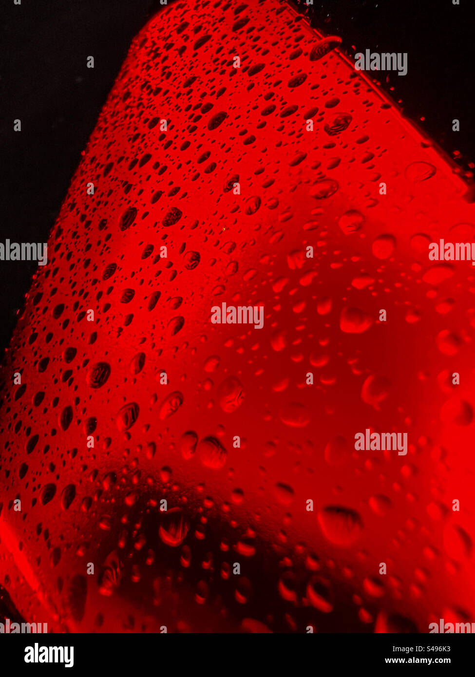 Red car light with raindrops Stock Photo - Alamy