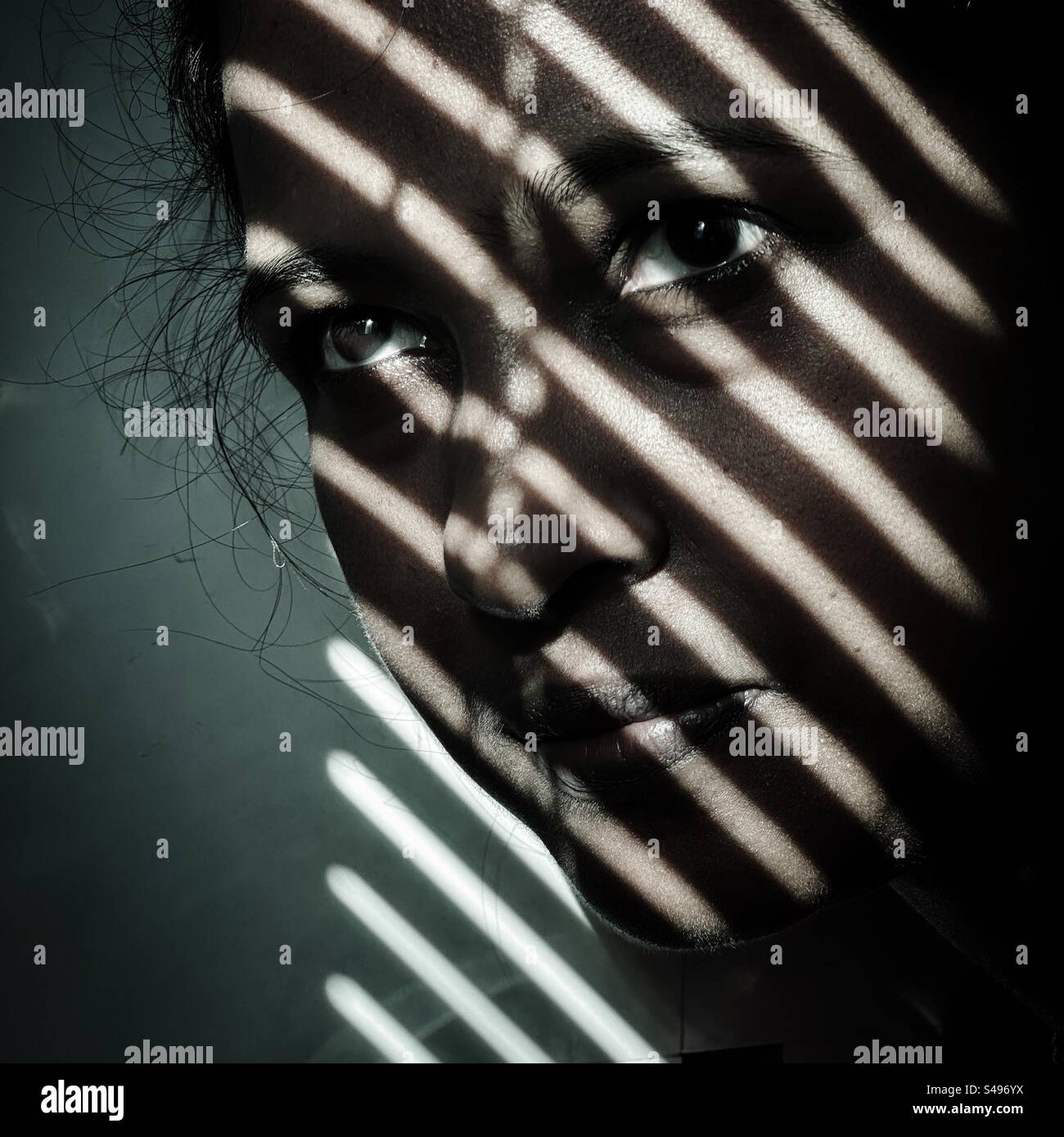 Shadows from the window blinds falling on a face Stock Photo - Alamy