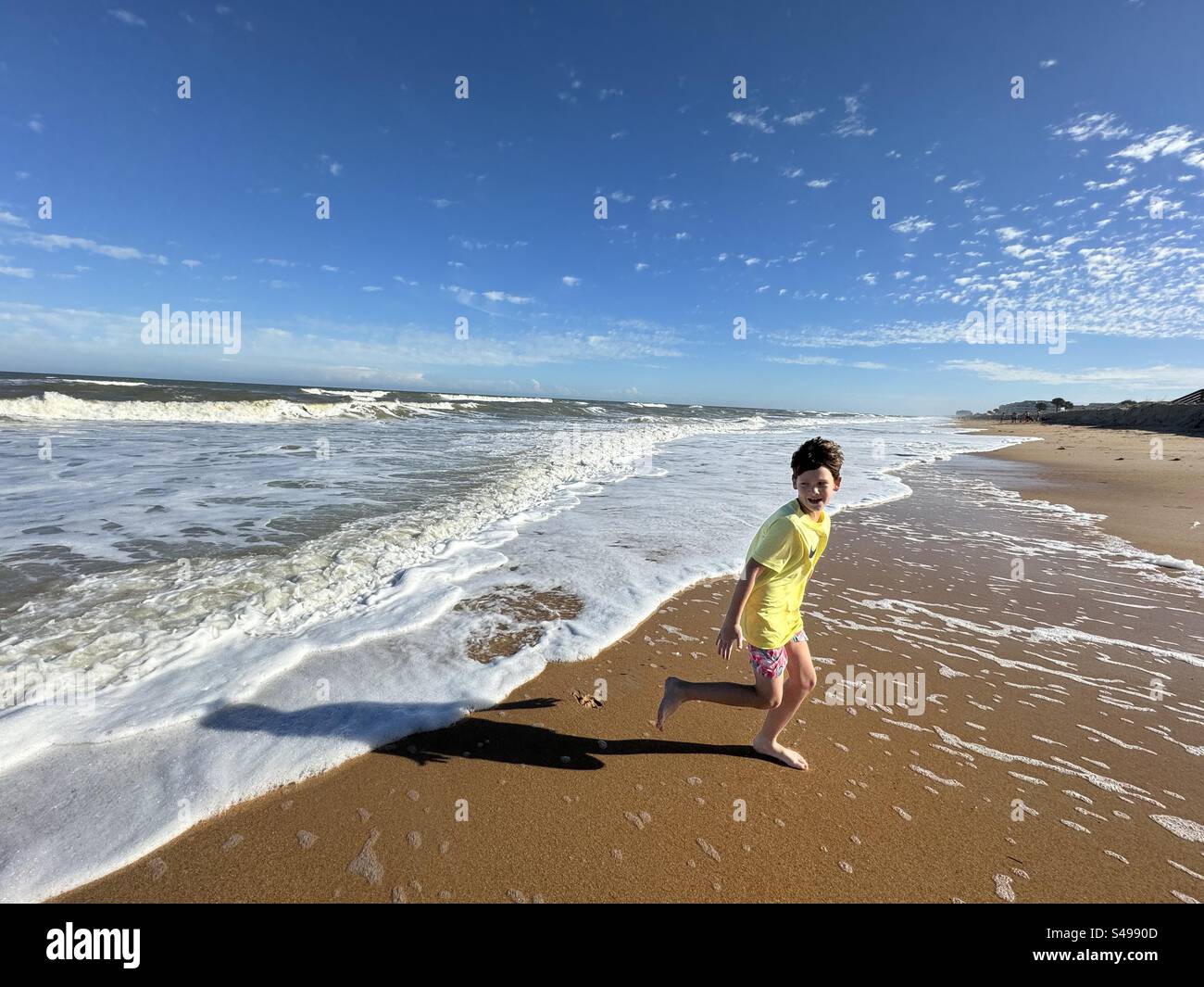 Running into waves hi-res stock photography and images - Alamy