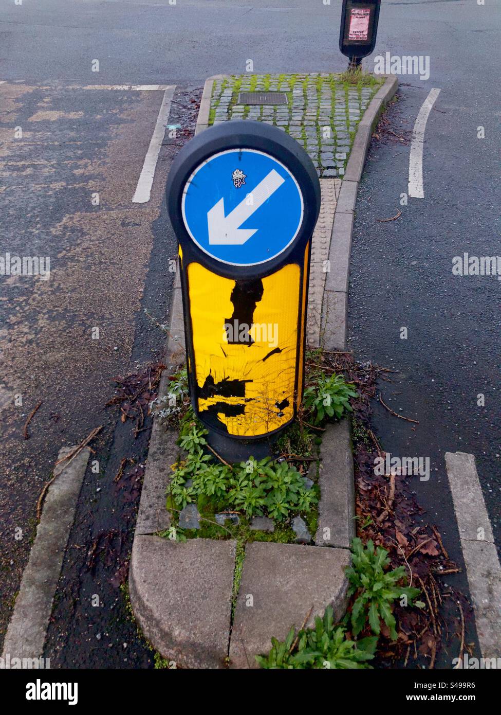 Keep left sign traffic island direction to superstore weeds creeping ...