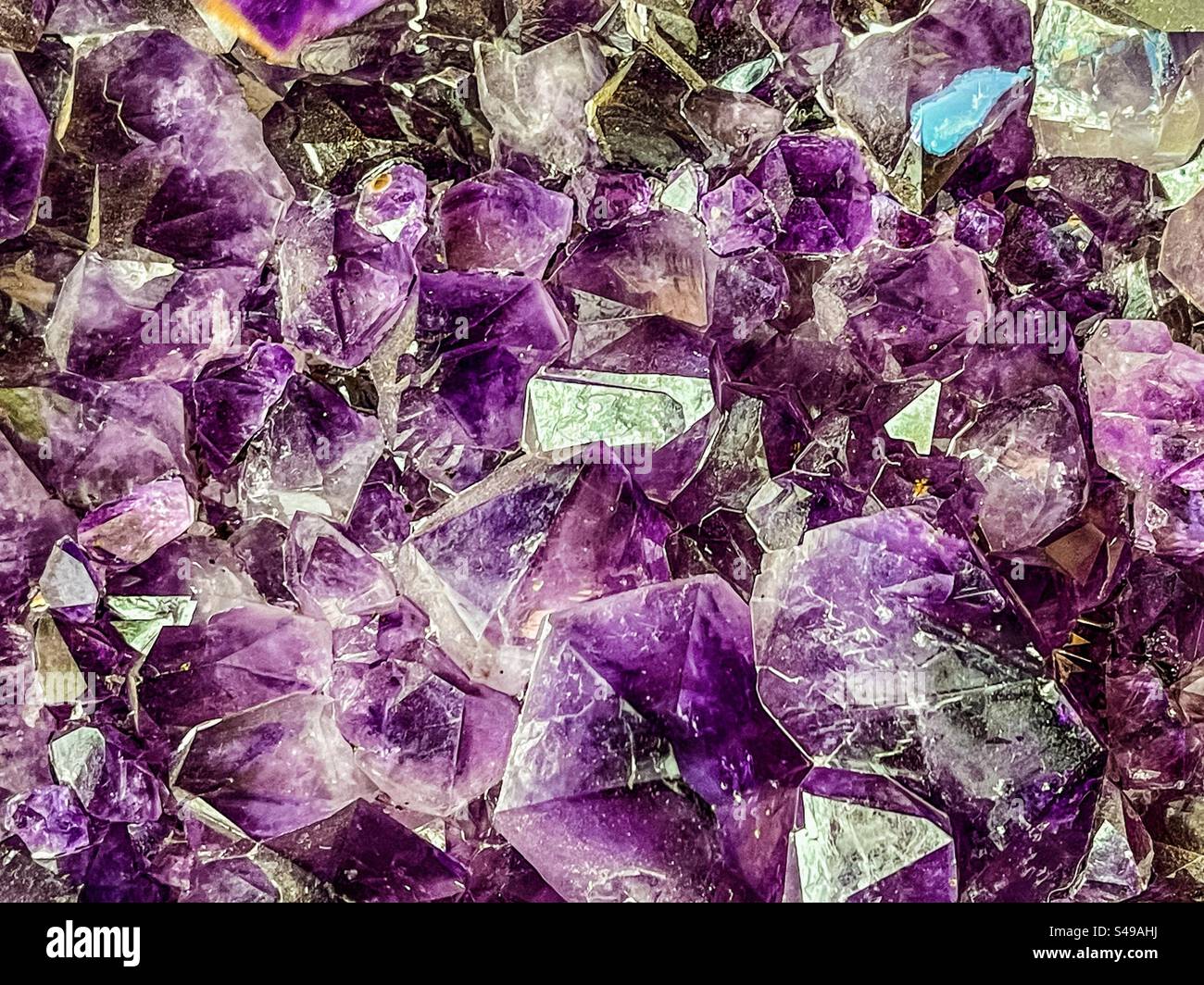 Full frame close-up of amethyst quartz crystals. Backgrounds. Crystal ...