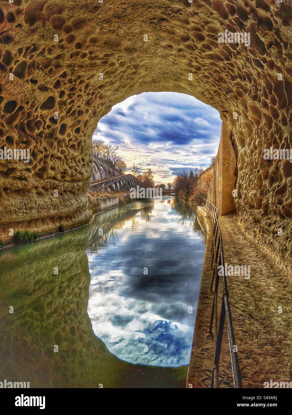 Malpas tunnel passing under the Enserune hill. Canal du Midi. Nissan ...