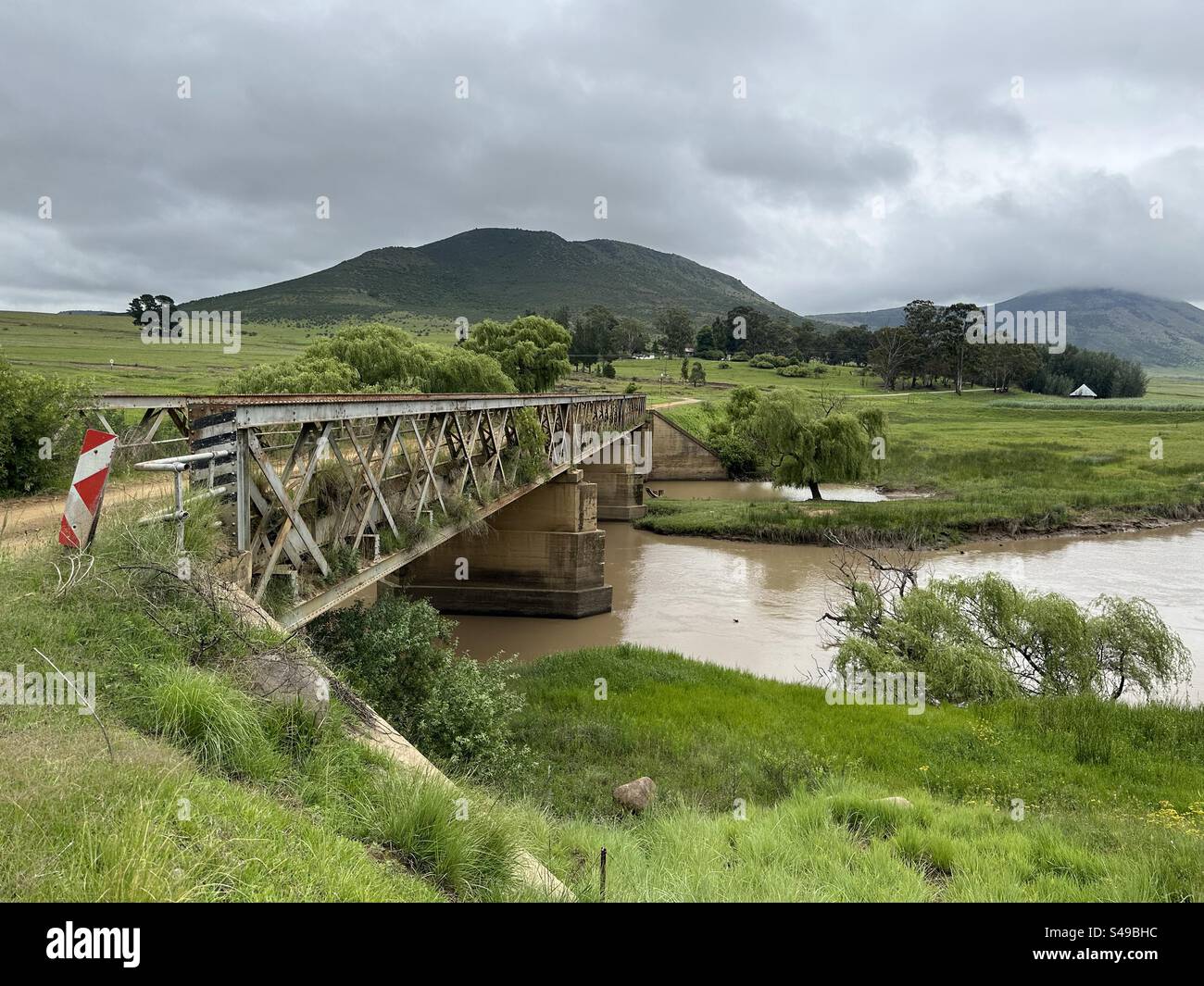 Rusty old steel bridge over the Mzimvubu River in rural Eastern Cape ...