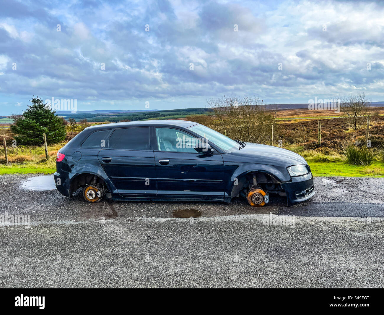 Black Audi A3 with its wheels stolen Stock Photo - Alamy