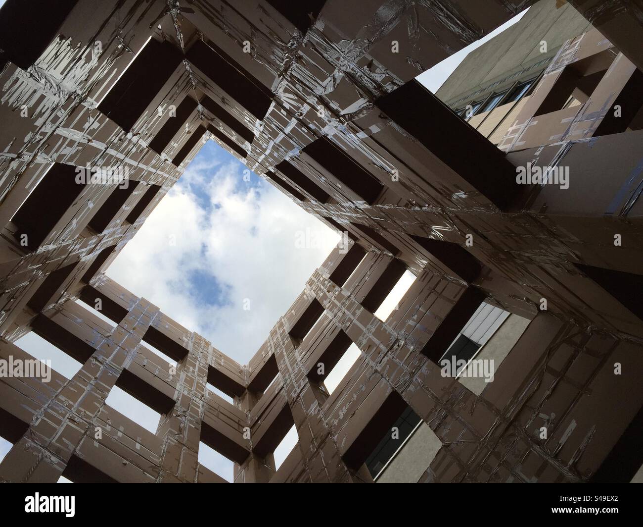 A community art project constructing a very large tower made out of ...