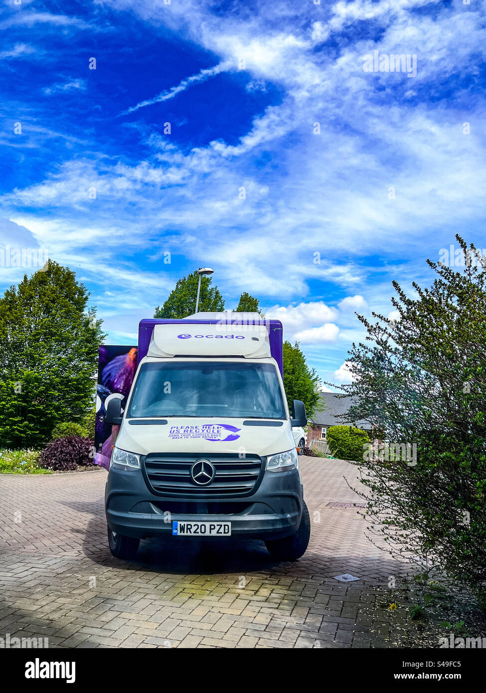 Ocado shopping delivery van at residential property Stock Photo - Alamy