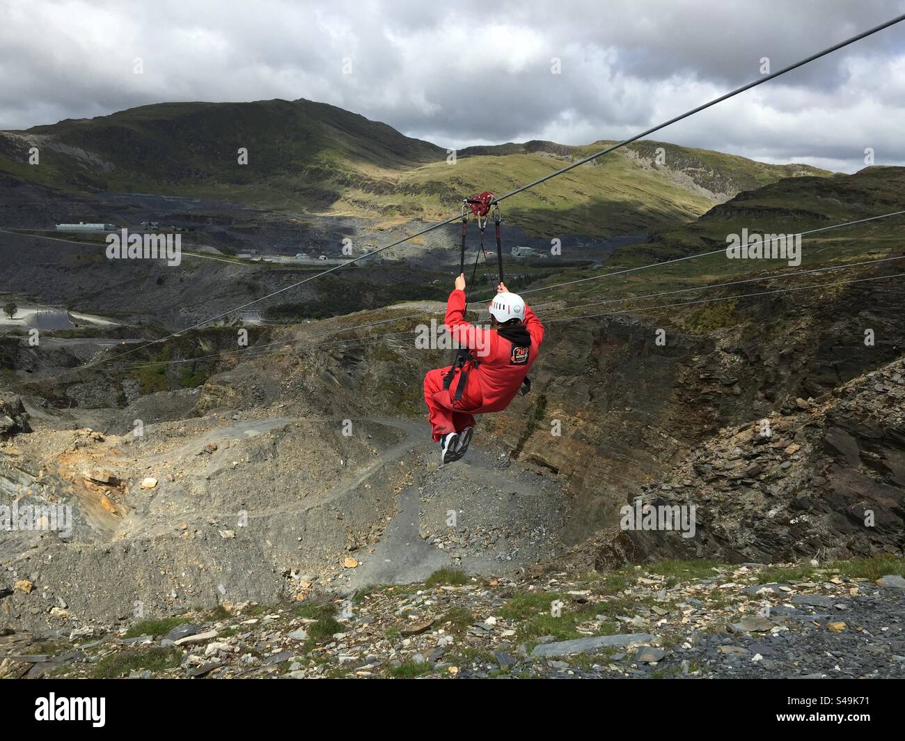 Person zip lining hi-res stock photography and images - Alamy