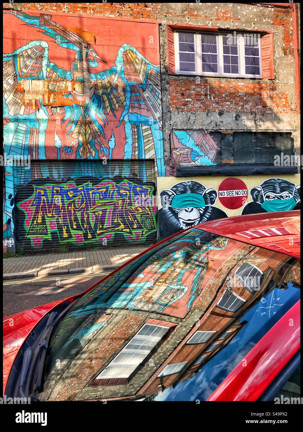 A colourful image with interesting street art (graffiti?) in a European ...