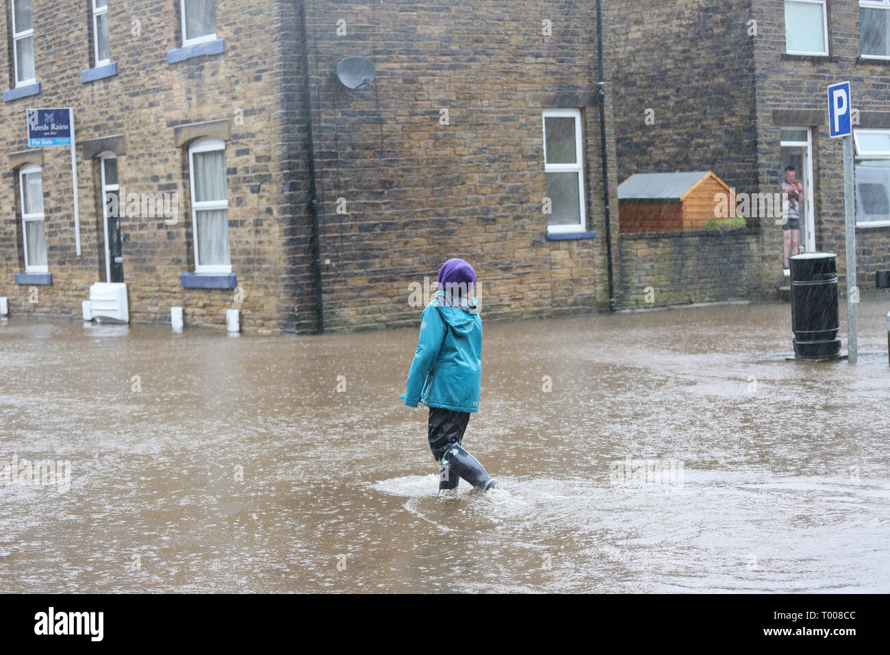 Walsden,Todmorden, Calderdale, UK. 16th March 2019. A youngster walking ...